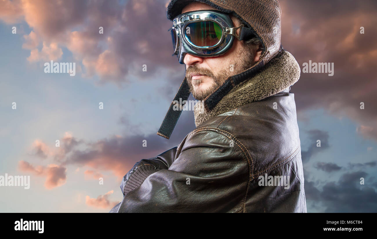 Proud, pilot of the 20s with sunglasses and vintage aviator helmet ...