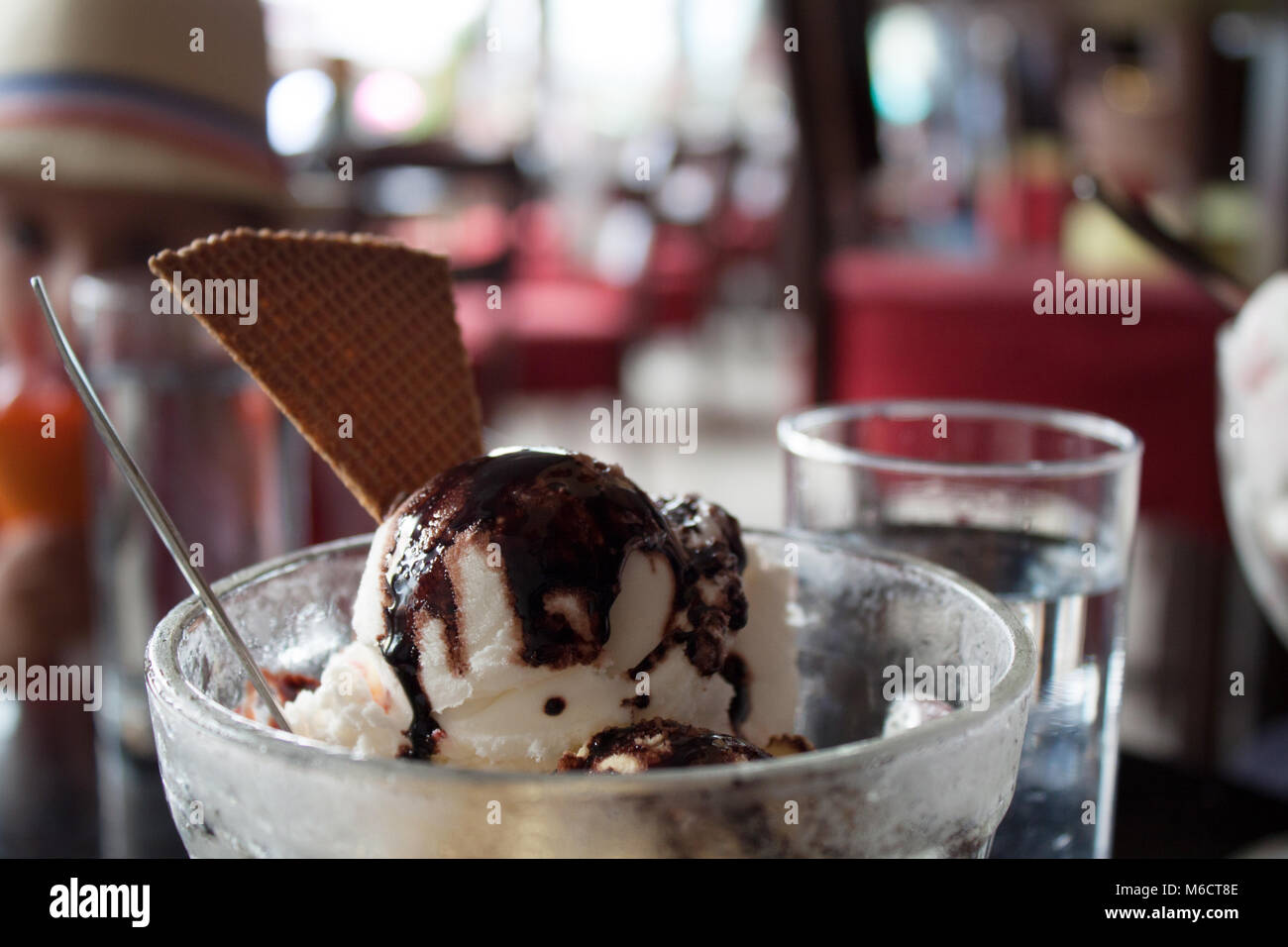 Delicious ice cream with its dressing on blur background Stock Photo ...