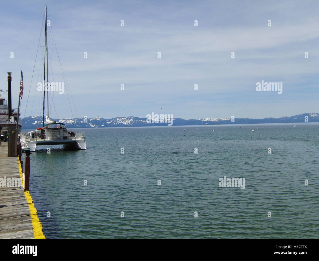 Yacht approaching the pier Stock Photo - Alamy
