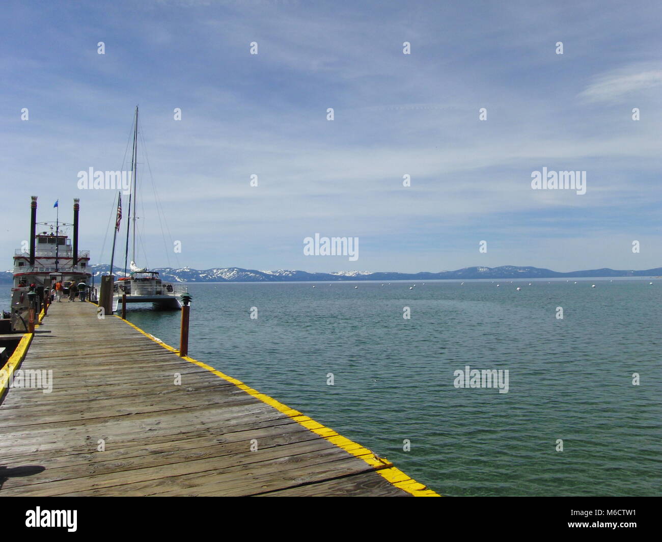 Yacht approaching the pier Stock Photo - Alamy