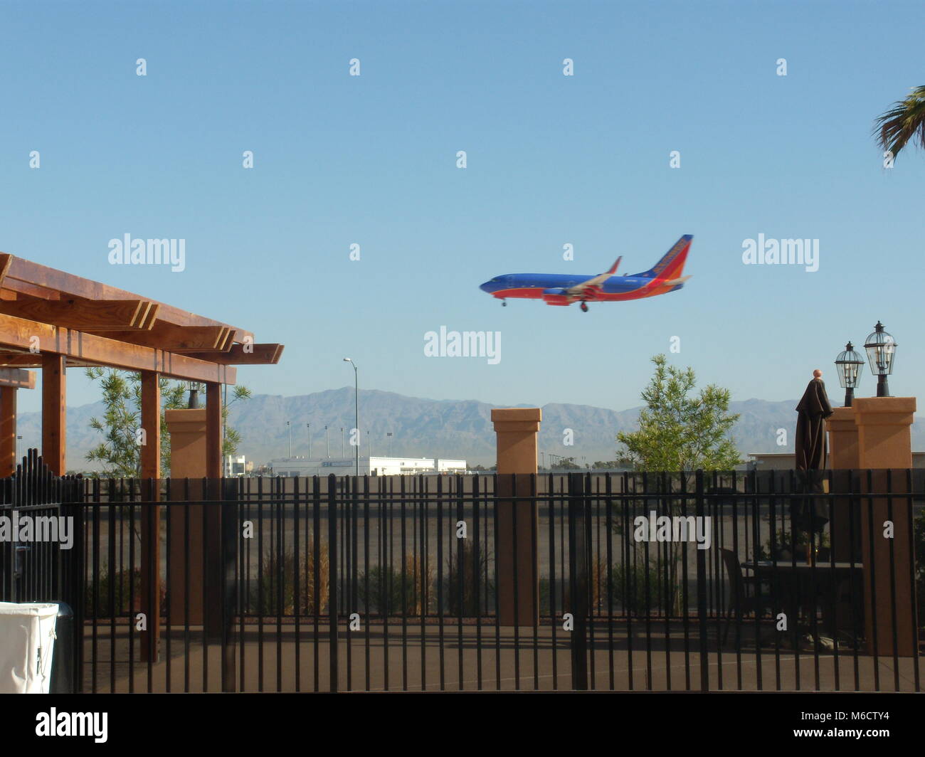 View from the pool on airplane landing close up Stock Photo - Alamy