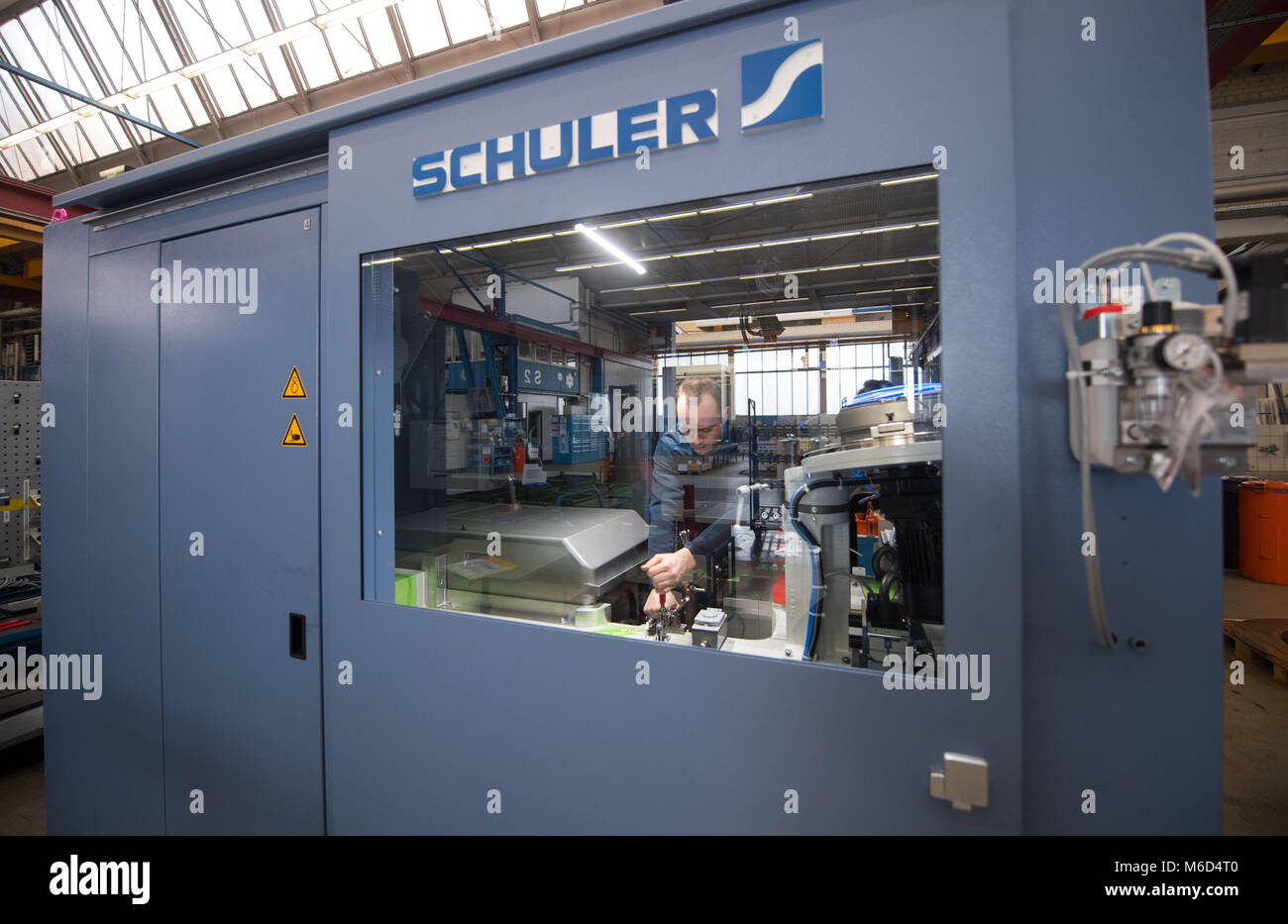 02 March 2018, Germany, Goeppingen: An employee of the Schuler AG ...