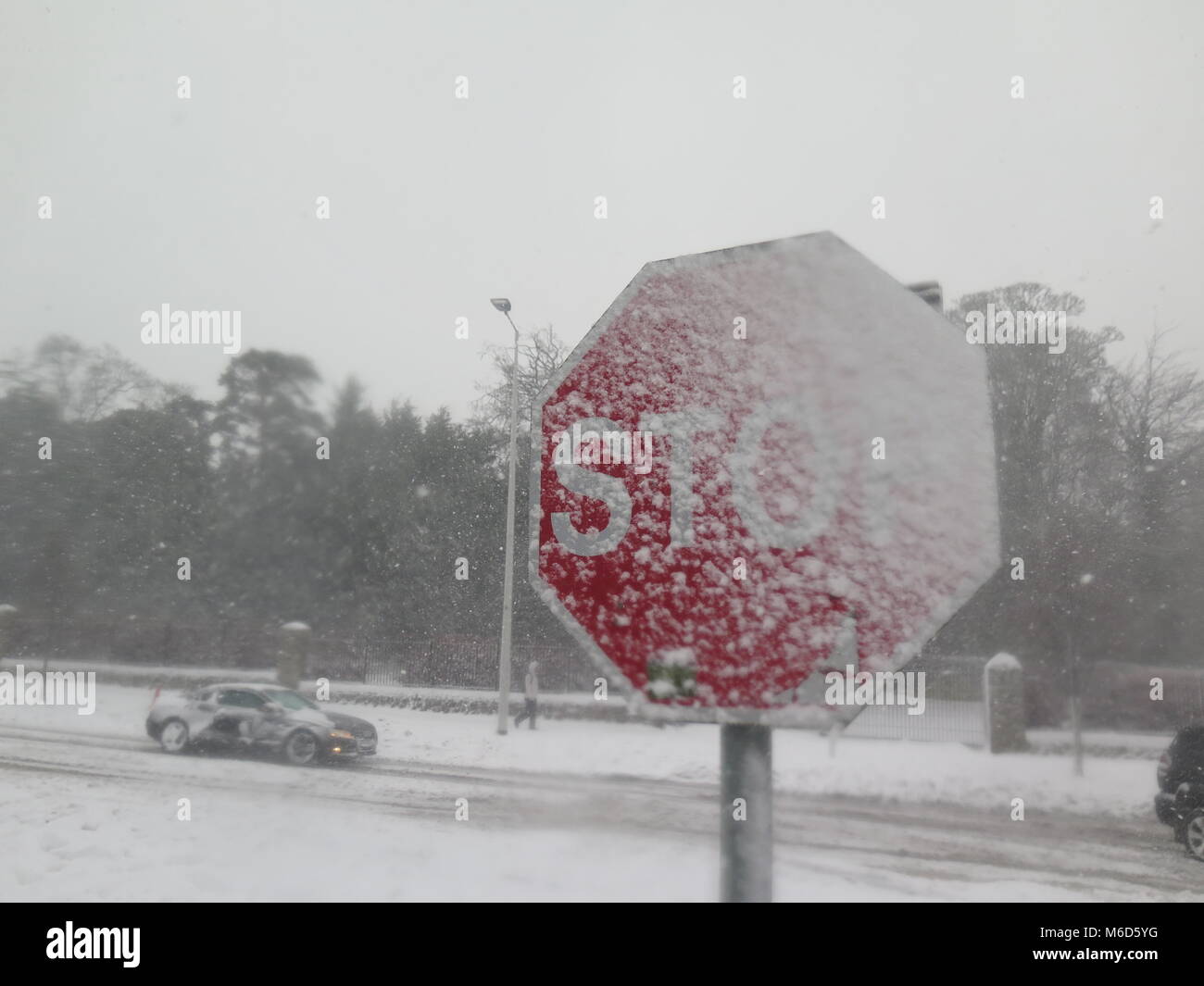 Dublin, Ireland. 2nd March, 2018. A frozen Stop sign on a road in ...
