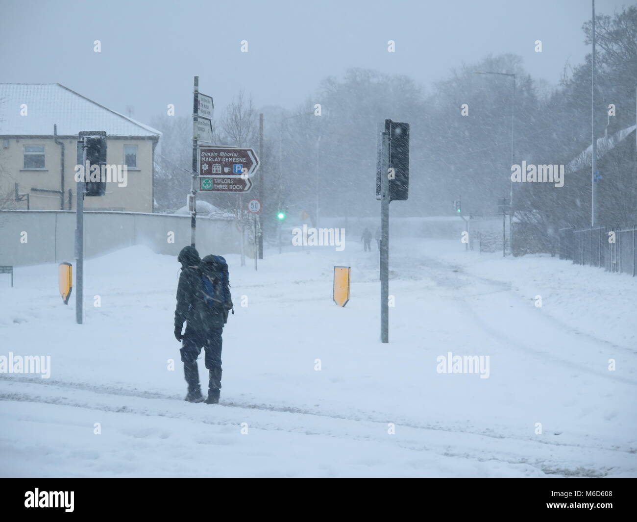 Dublin, Ireland. 2nd March, 2018. A man in heavy winter clothing walks ...