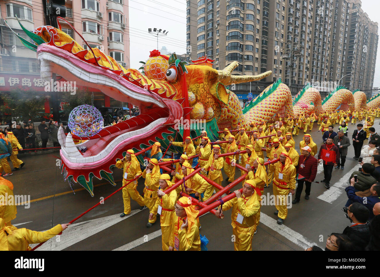 Pingyang, China's Zhejiang Province. 2nd Mar, 2018. People carry a ...