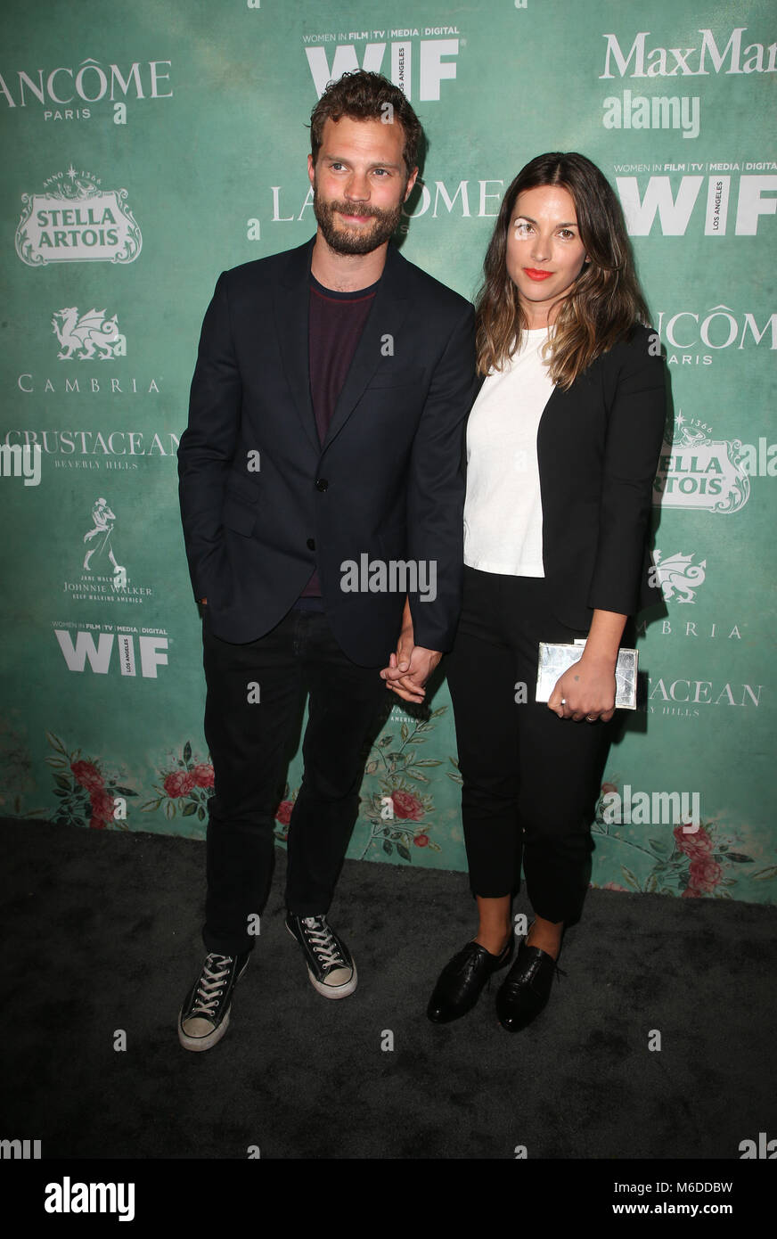 Beverly Hills, Ca. 2nd Mar, 2018. Jamie Dornan, Amelia Warner, at the 11th Annual Women In Film ...