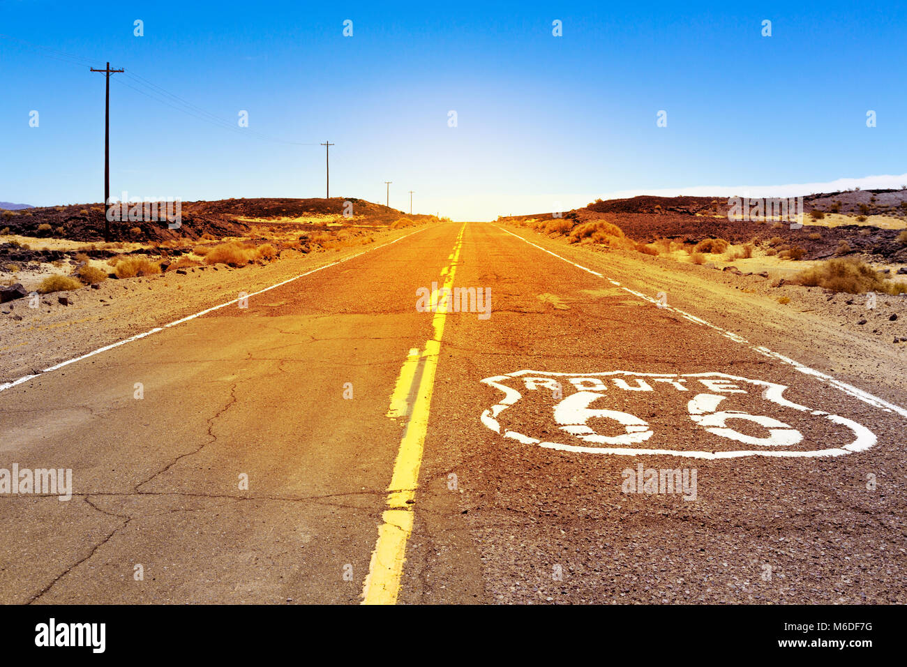 Iconic Route 66 sign on the road in American desert land Stock Photo ...