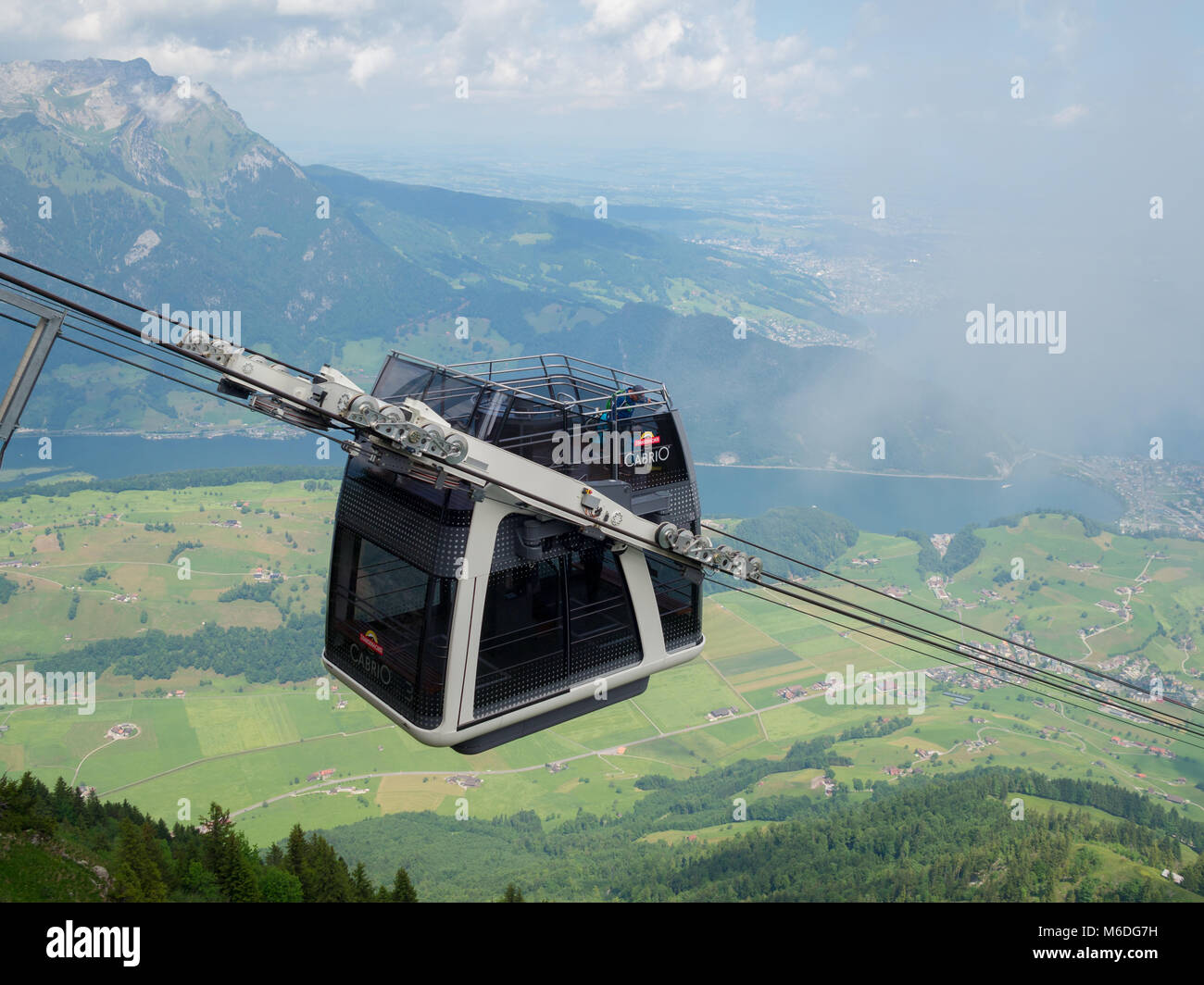 CabriO cable car over the green landscape Stock Photo - Alamy