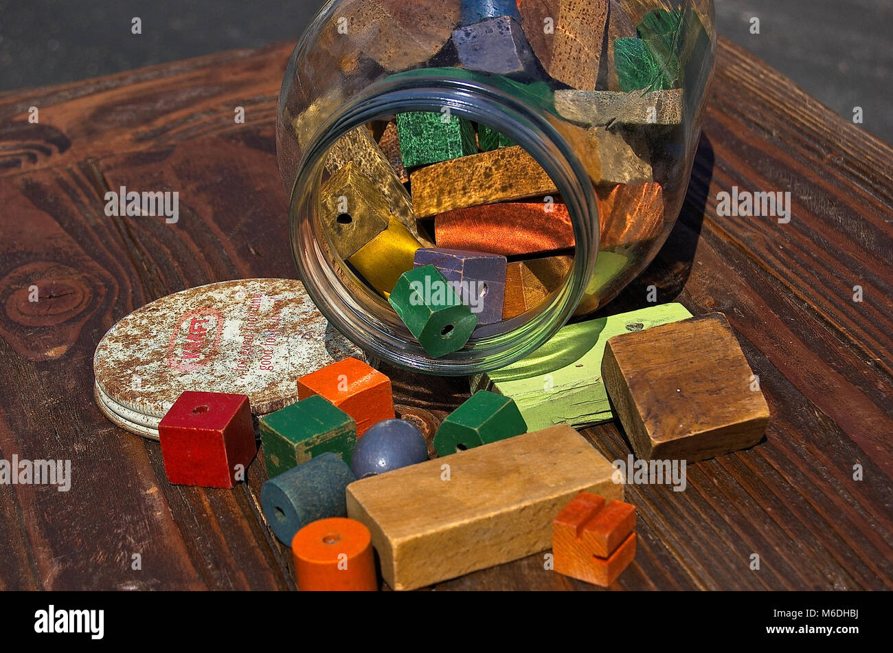 Old wooden children's toys in a glass jar Stock Photo - Alamy