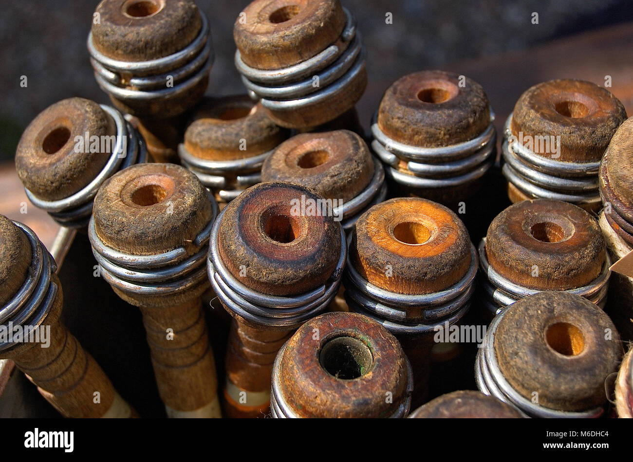 Antique wooden spools from a loom Stock Photo - Alamy