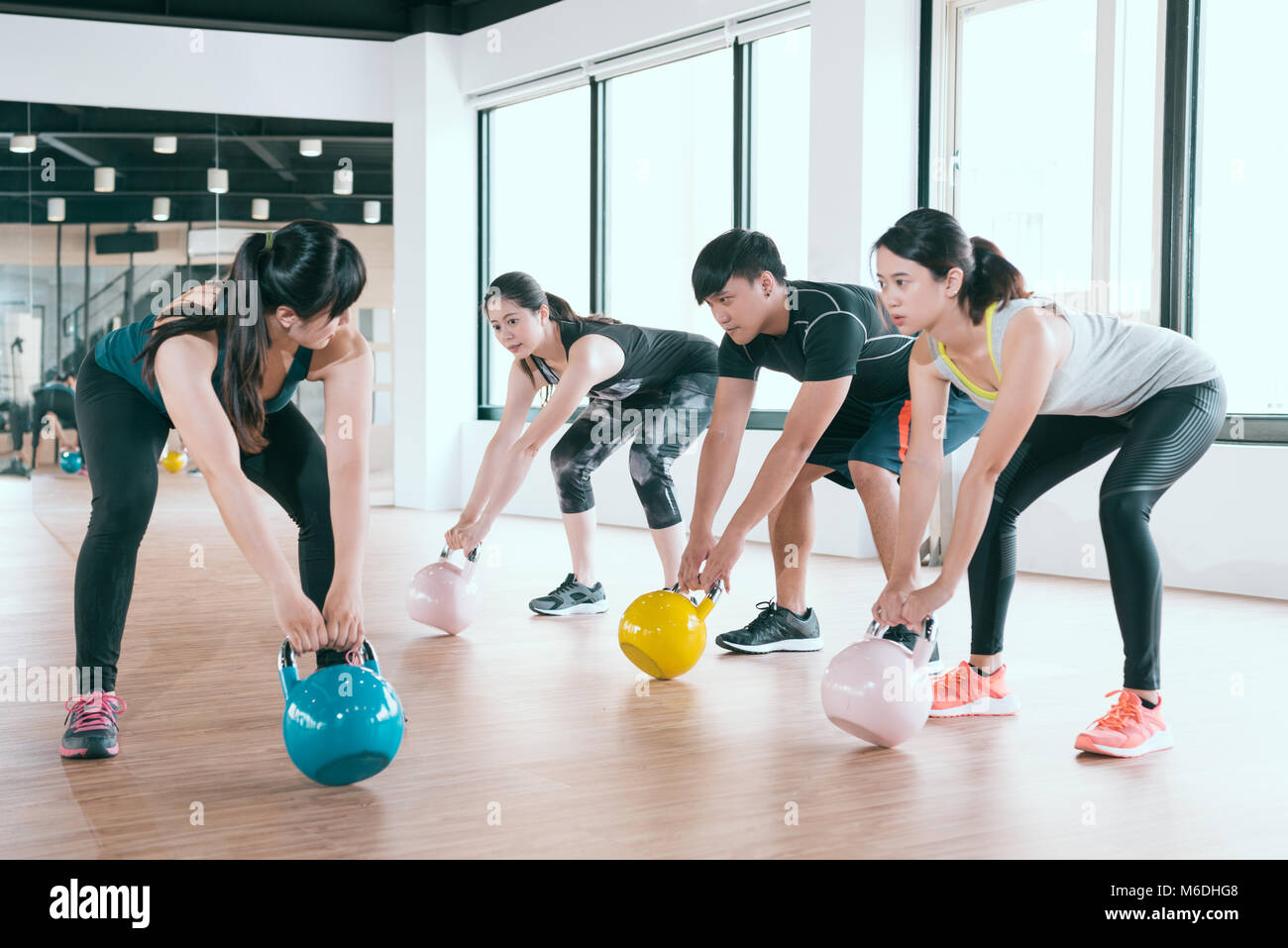 expert instructor starts to educate a team of fitness learner exercise ...