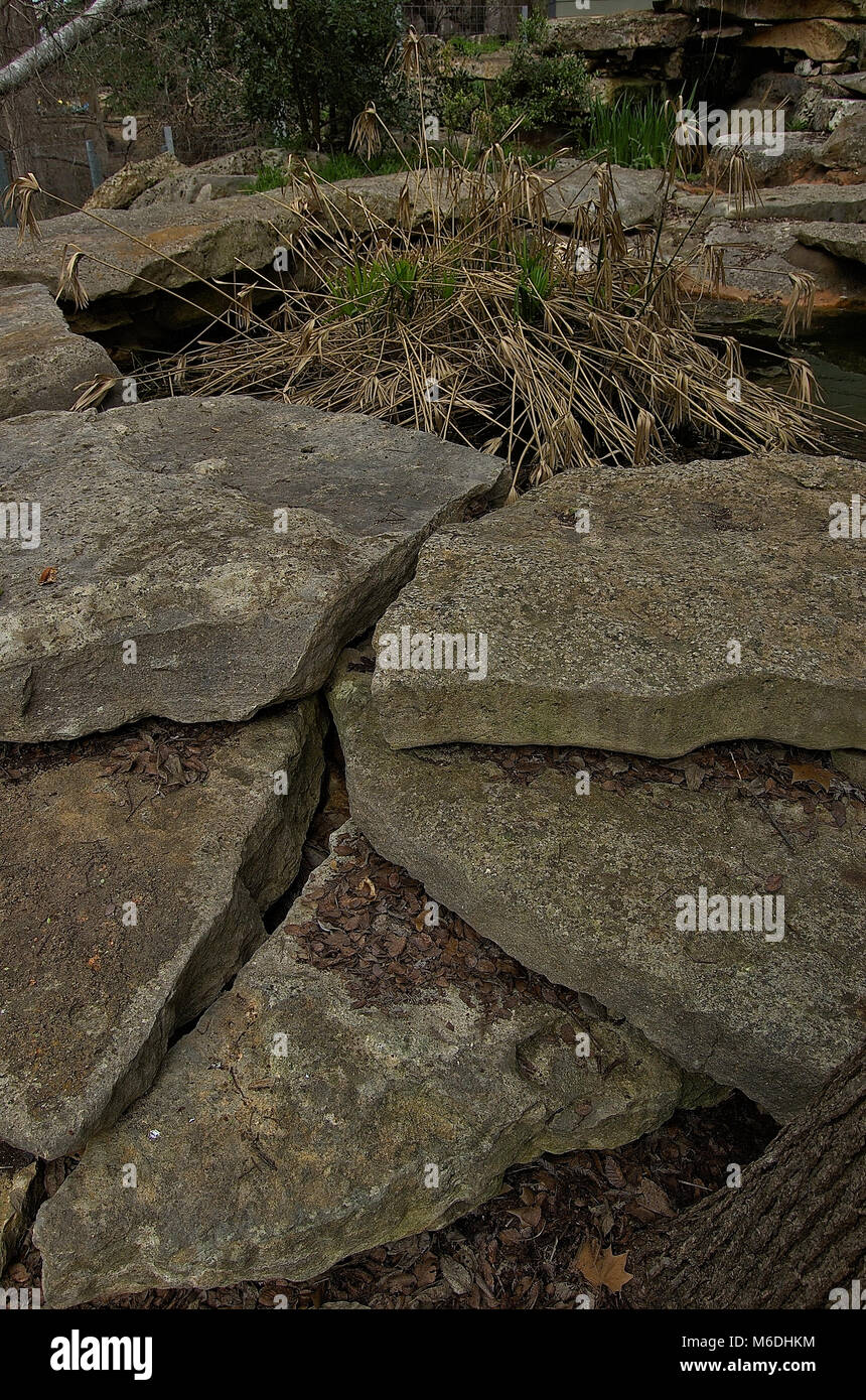 Water pond in the fall with big boulders Stock Photo - Alamy