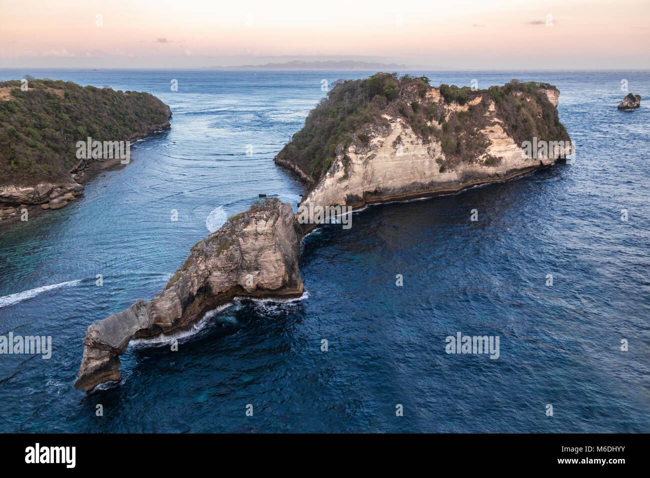 The beautiful pink sunset at Atuh Beach, Indonesia Stock Photo - Alamy