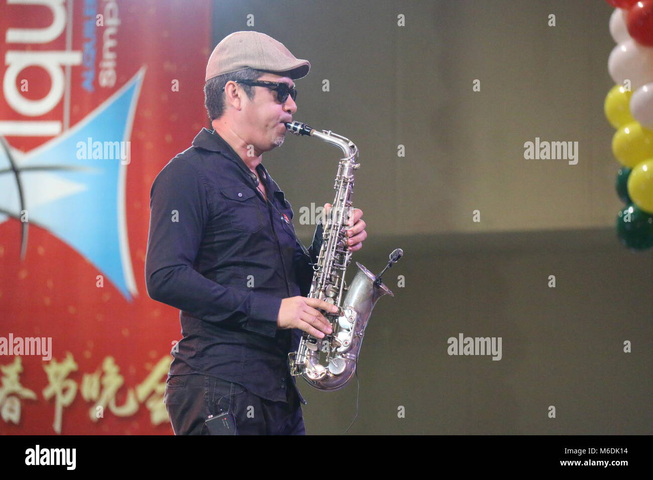 Guy playing the saxophone Stock Photo - Alamy