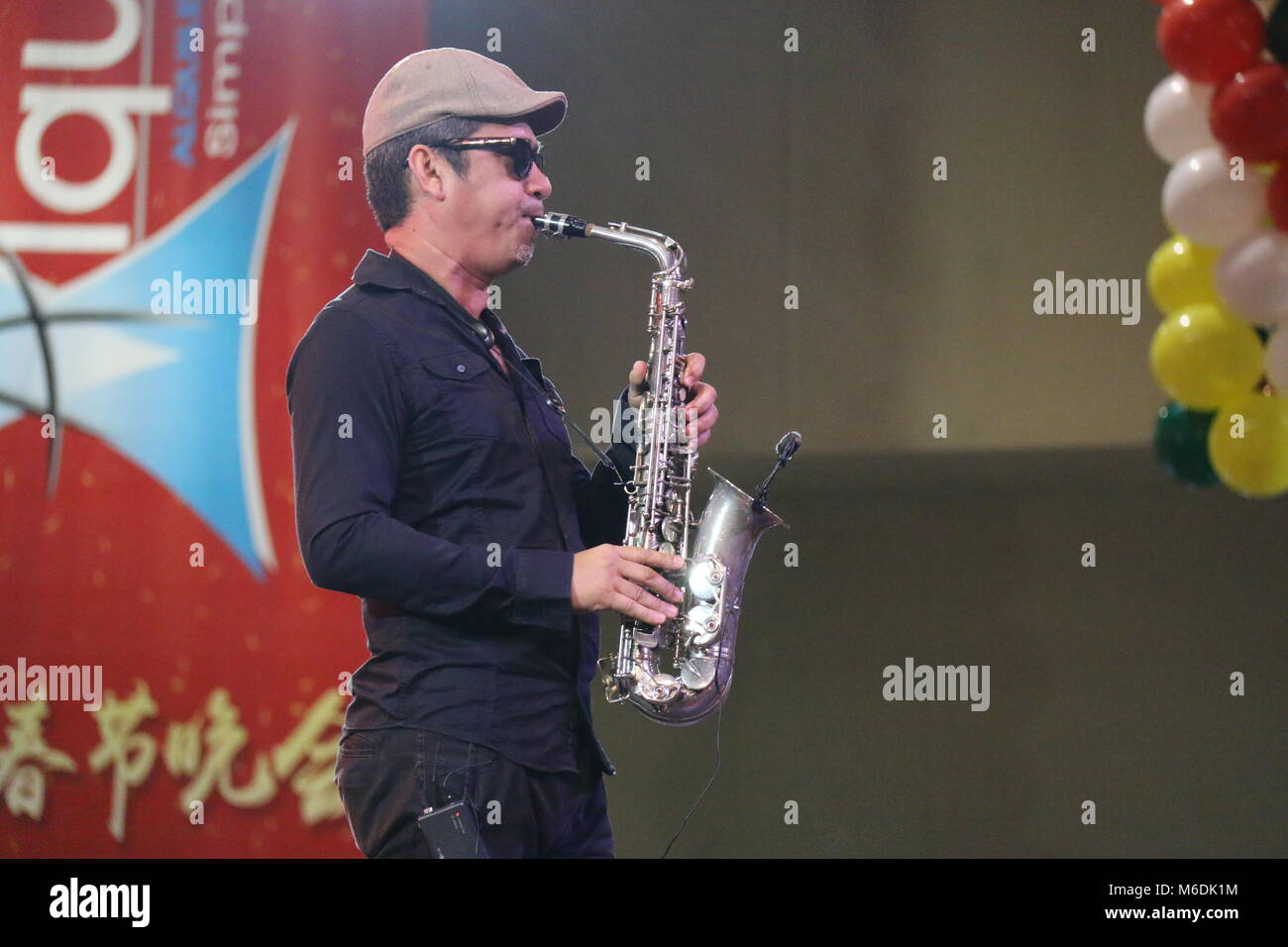 Guy playing the saxophone Stock Photo - Alamy