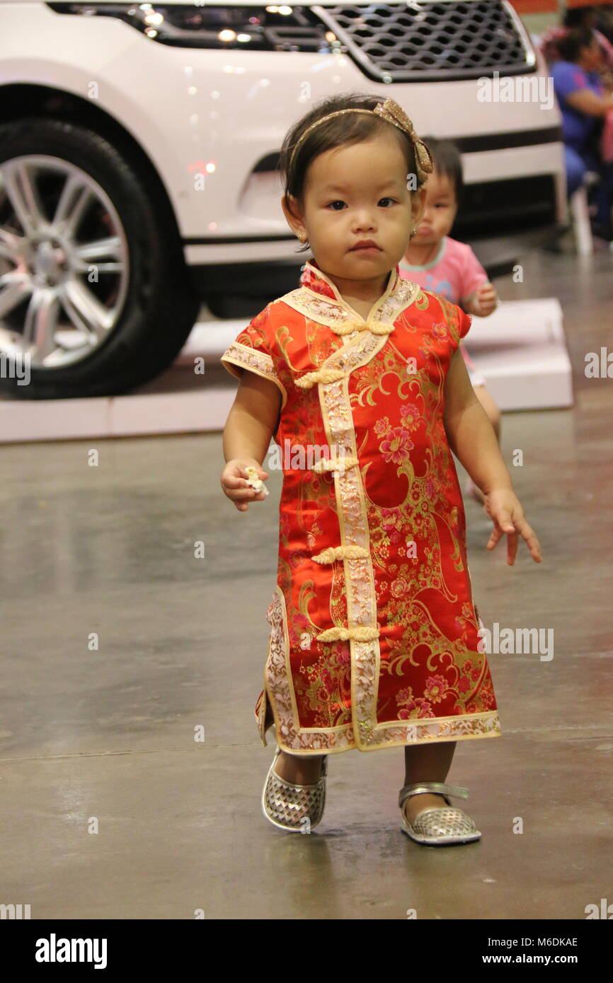 Little chinese girl in traditional clothes at festival Stock Photo - Alamy