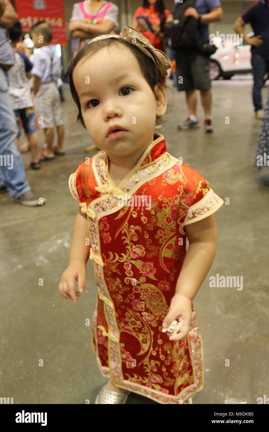 Little chinese girl in traditional clothes at festival Stock Photo - Alamy