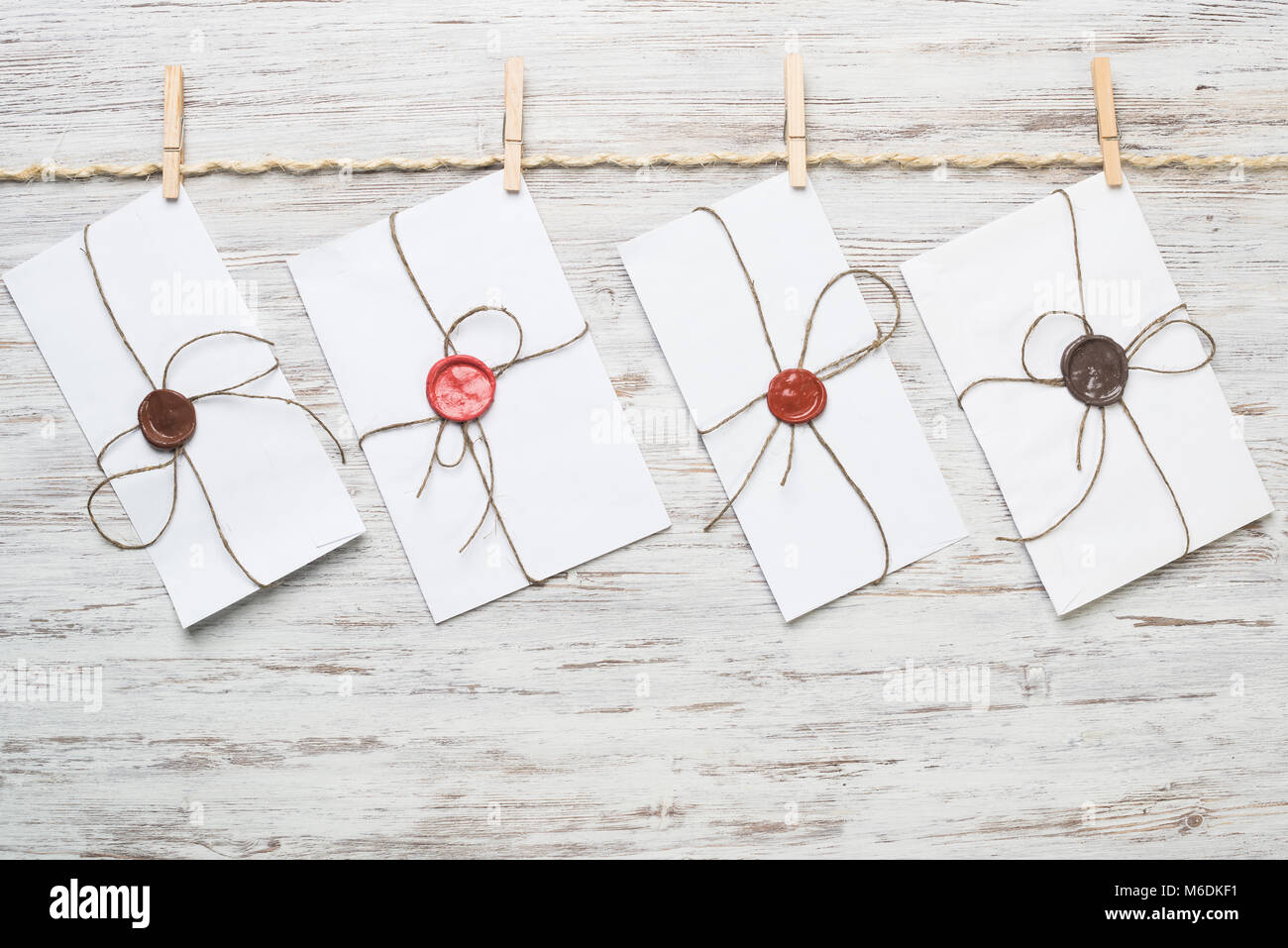 Mail envelope on rope Stock Photo - Alamy