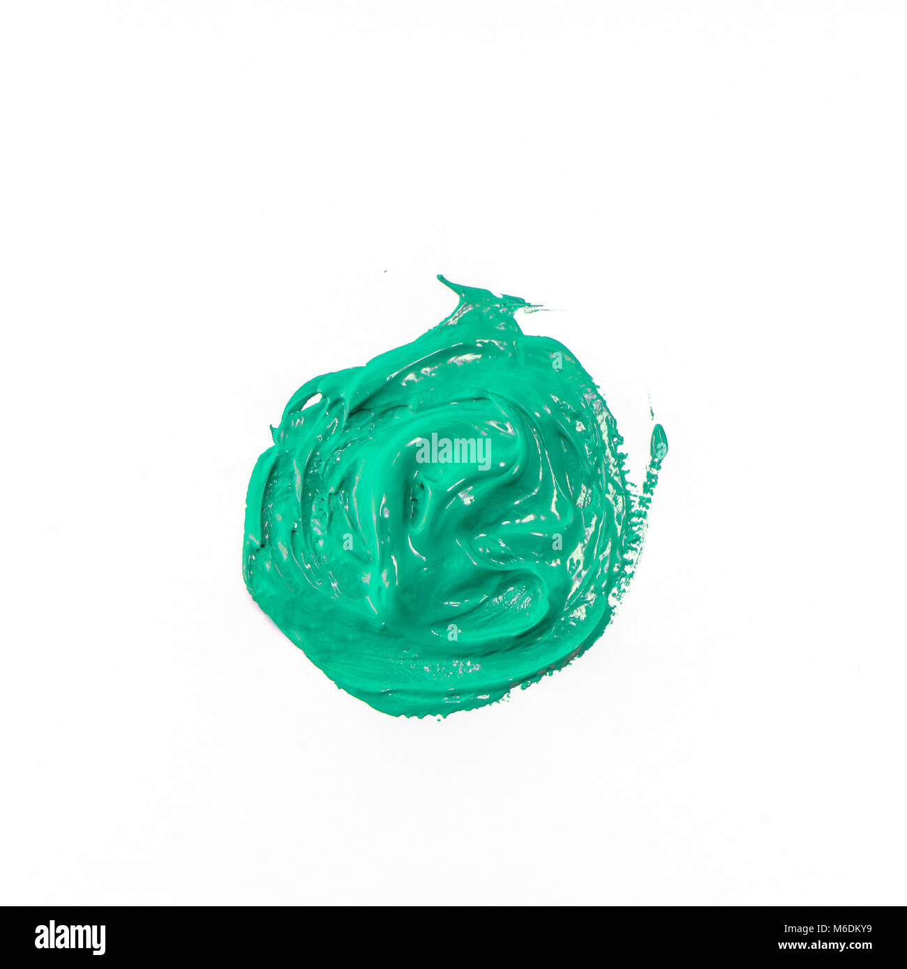 a drop of acrylic green color on a white surface Stock Photo - Alamy