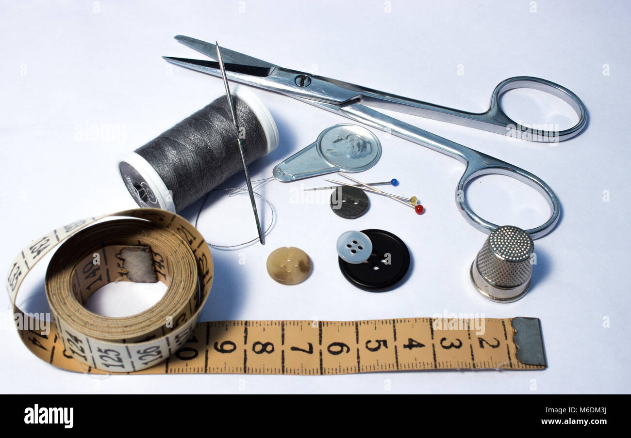 Sewing, thread coils, needles, needle threader, scissors, push pins ...