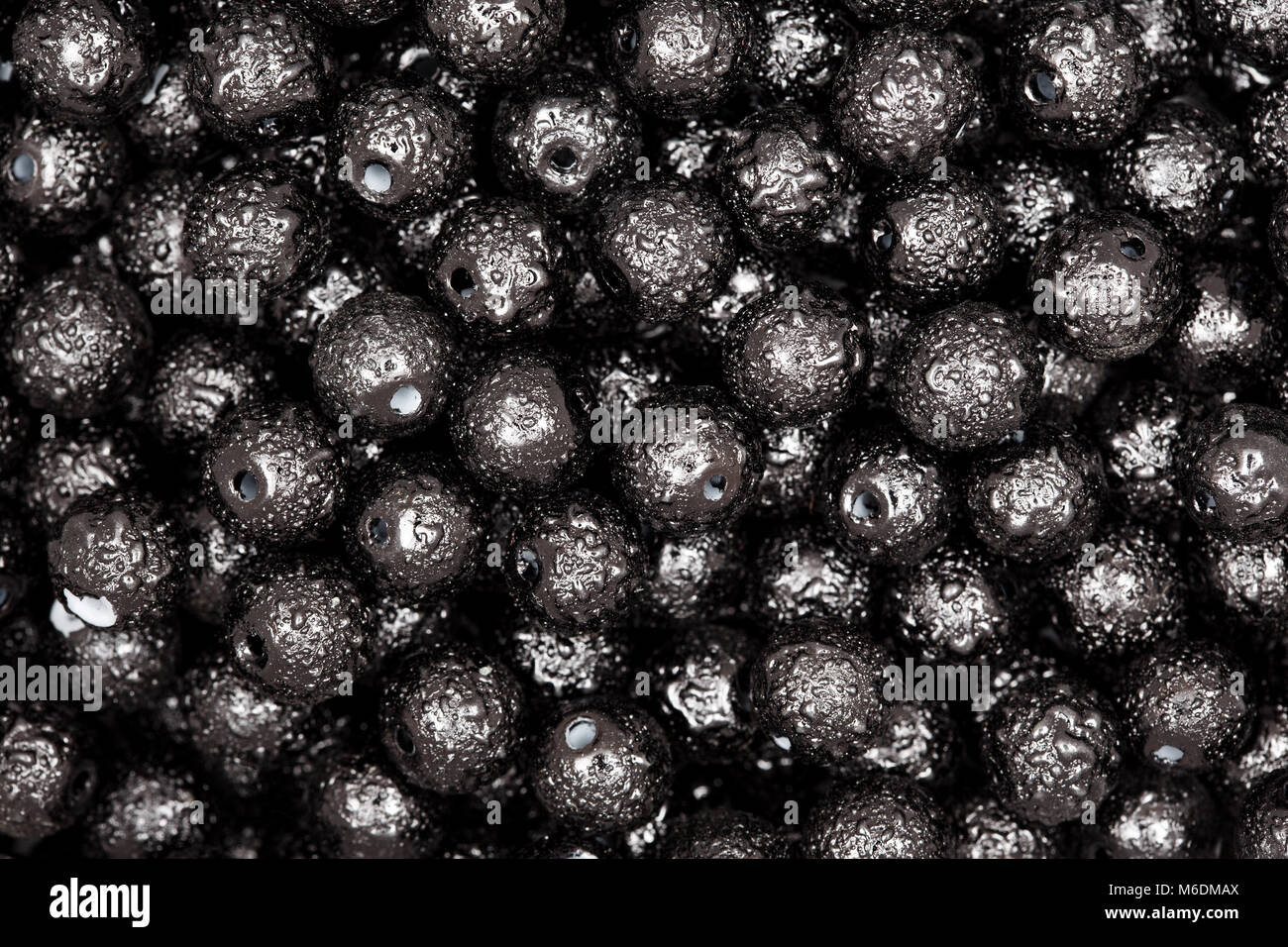 Black beads on macro. High resolution photo Stock Photo - Alamy