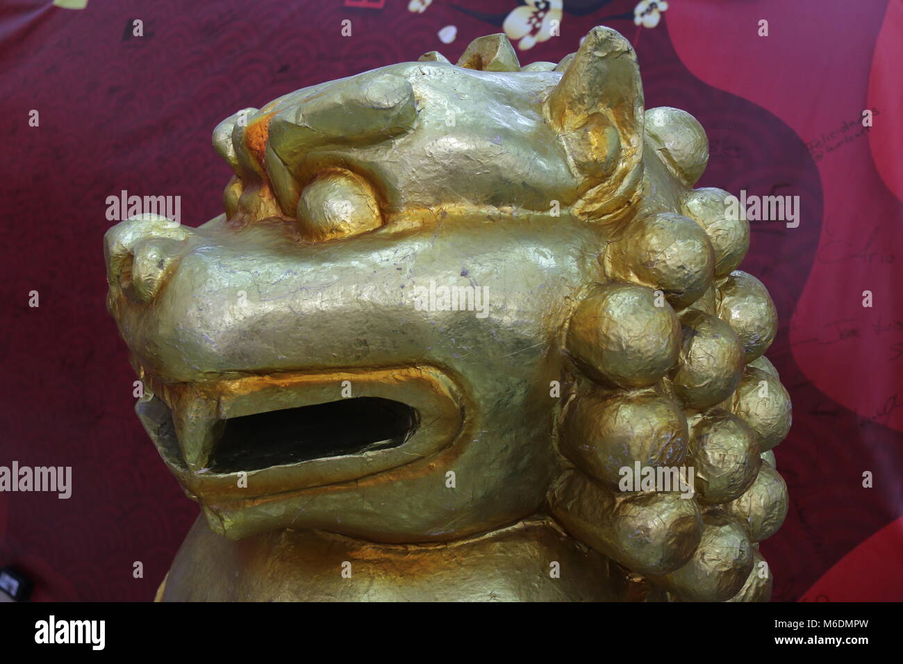 Golden chinese golden statue in Panama City, Panama Stock Photo - Alamy