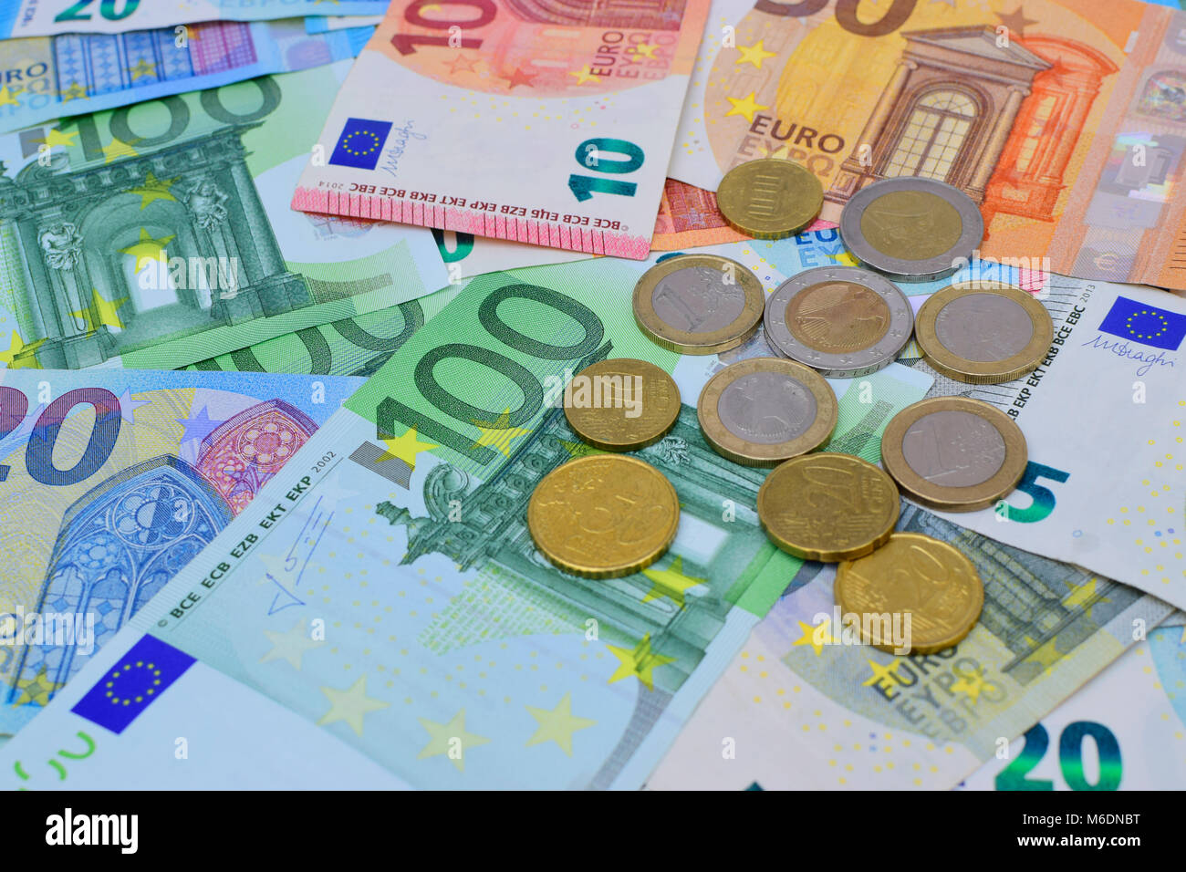 Closeup of money euros (banknotes and coins) background. Saving for ...