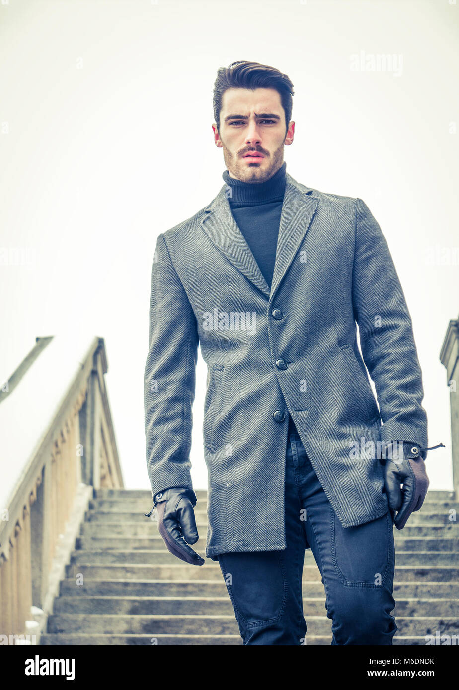 Handsome young man outdoor in winter fashion Stock Photo - Alamy