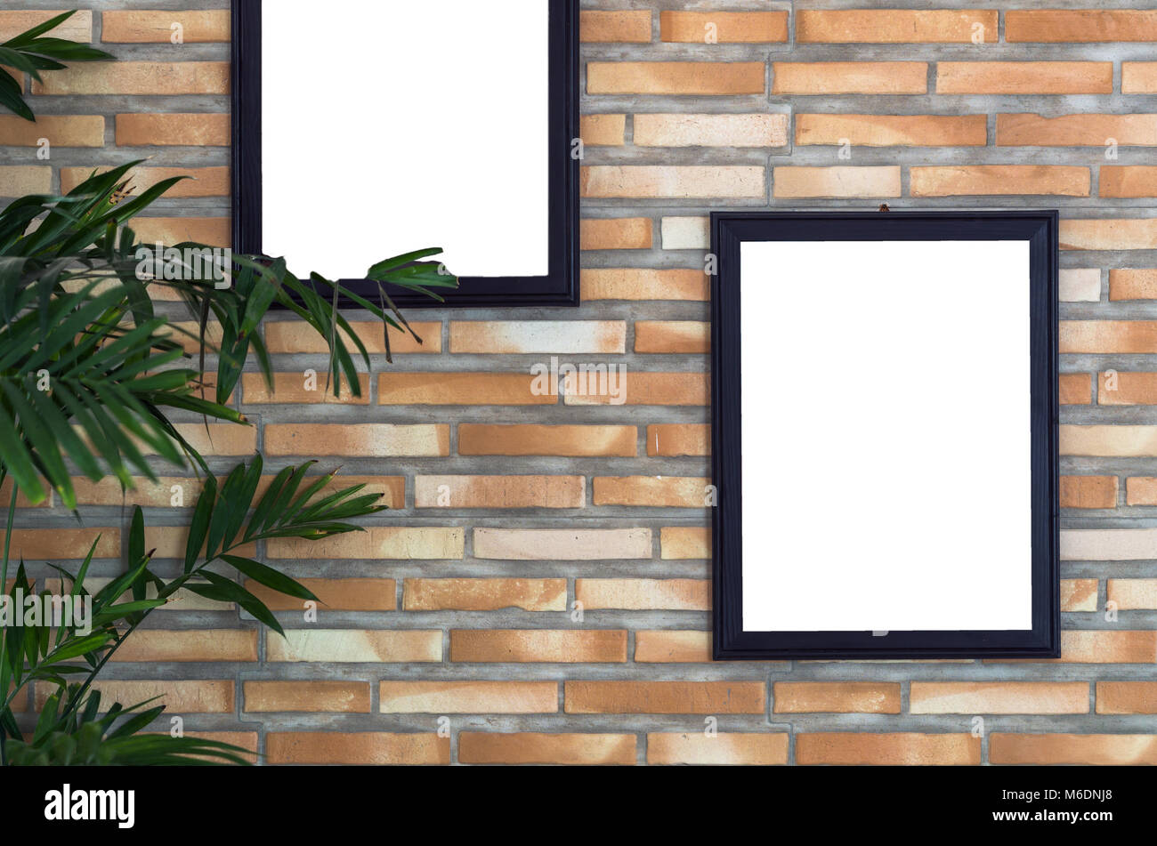 advertise frame on brick wall background Stock Photo - Alamy