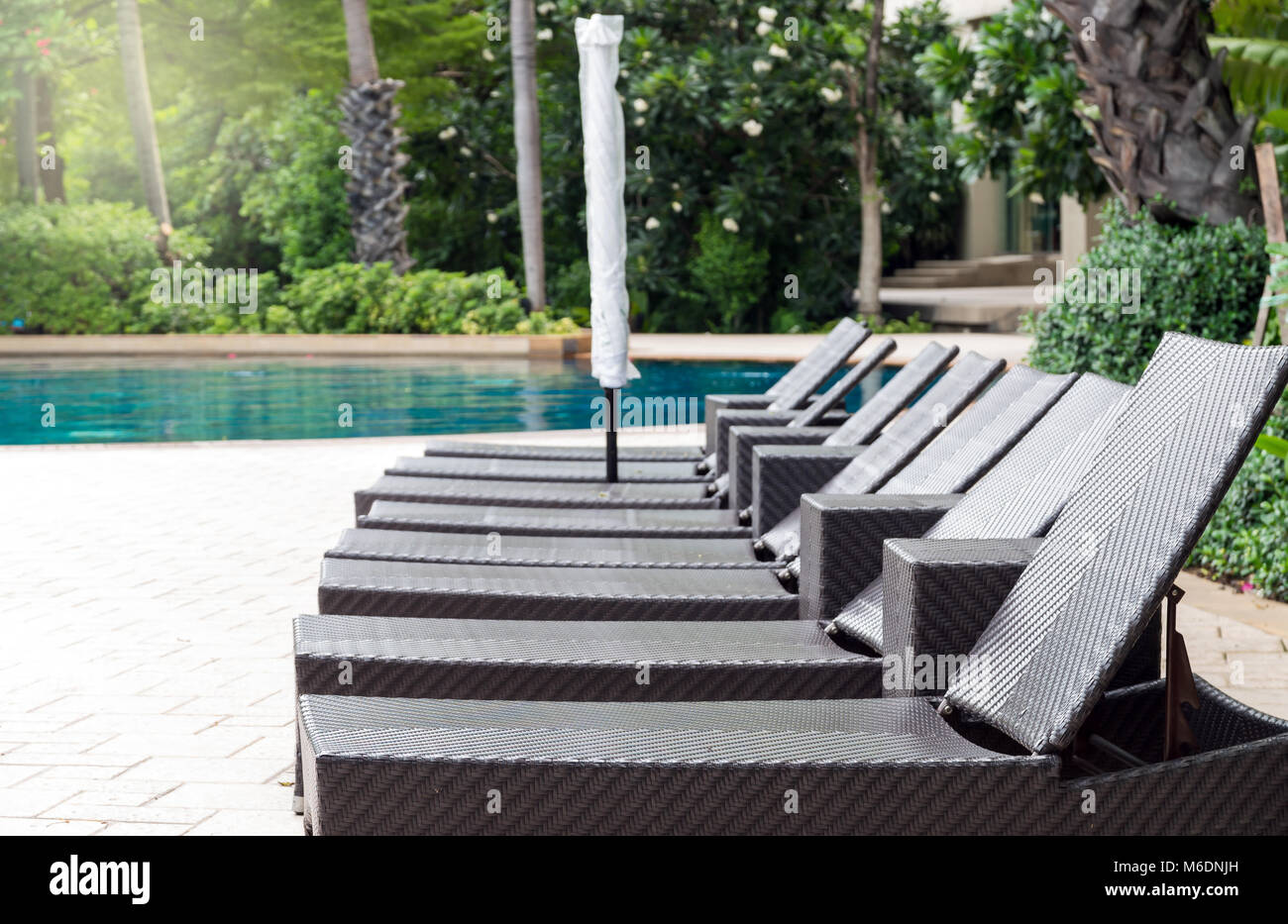 Luxury pool bed beside the swimming pool Stock Photo - Alamy