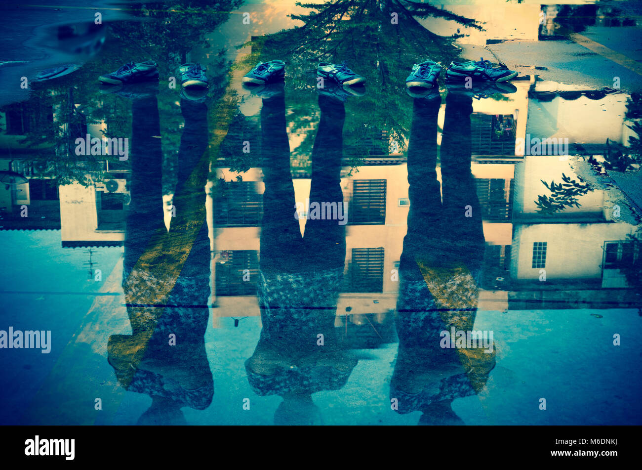 Three man reflection in the water after raining, double exposure of ...