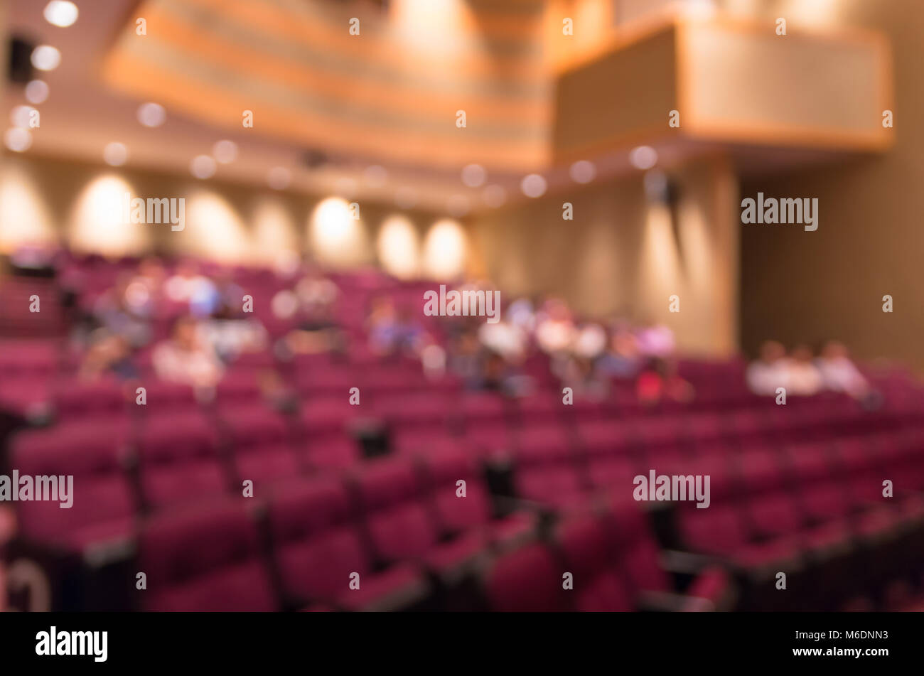 Abstract blurred photo of conference hall or meeting room with attendee ...