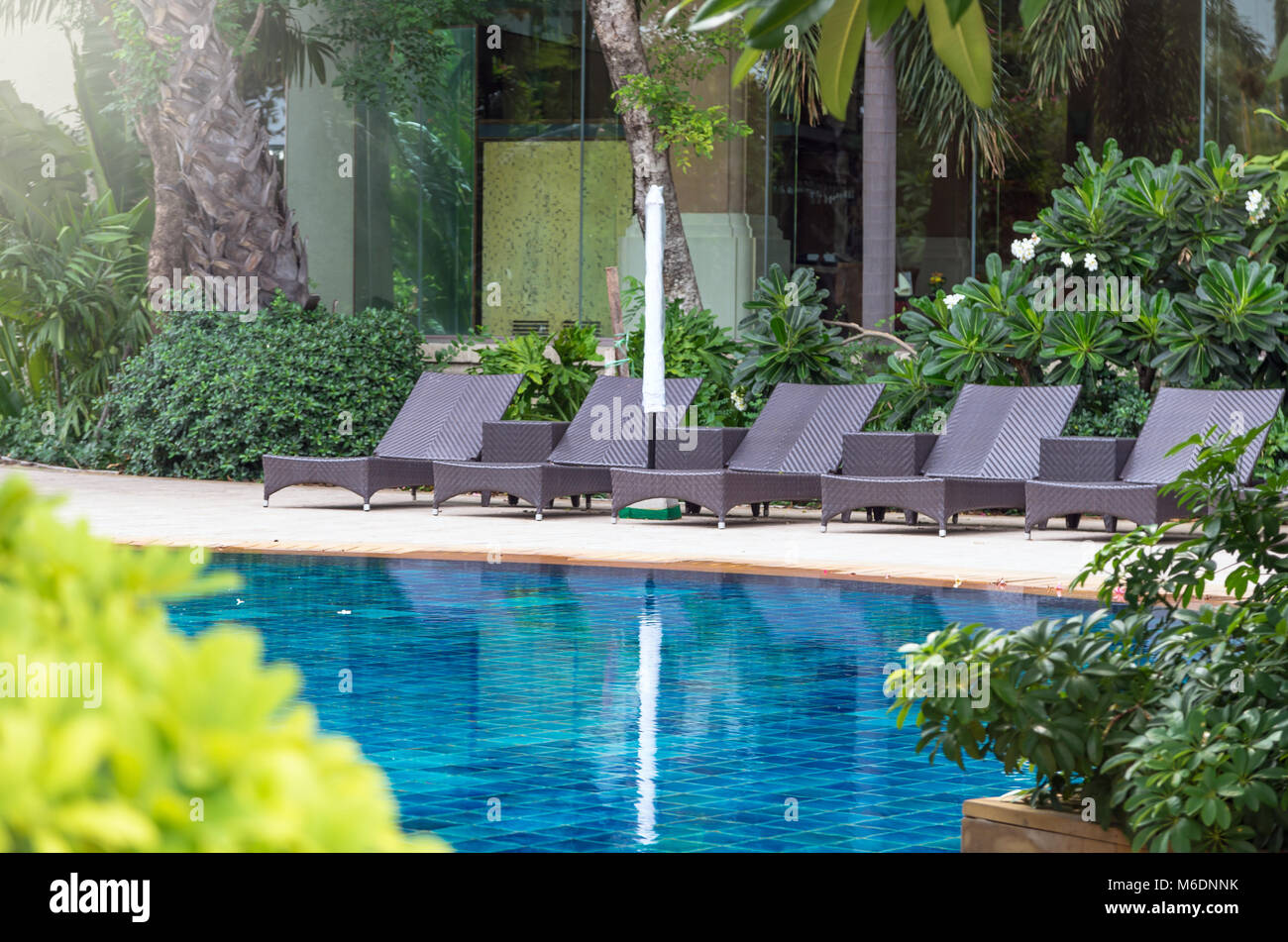 Luxury pool bed beside the swimming pool Stock Photo - Alamy