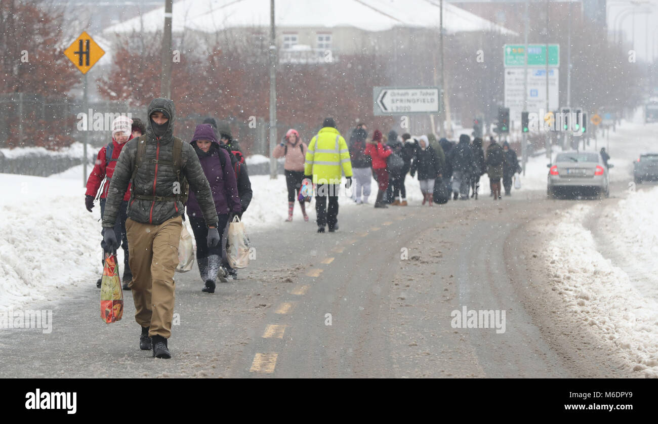 People walk along the N81 in Dublin as all public transport is still ...