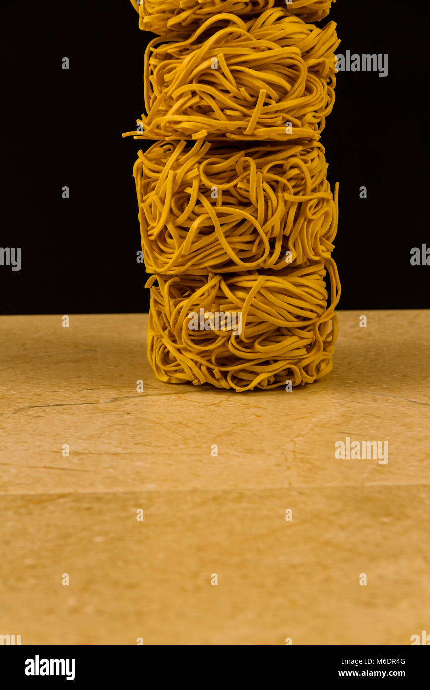 Stack of four noodle nests Stock Photo - Alamy