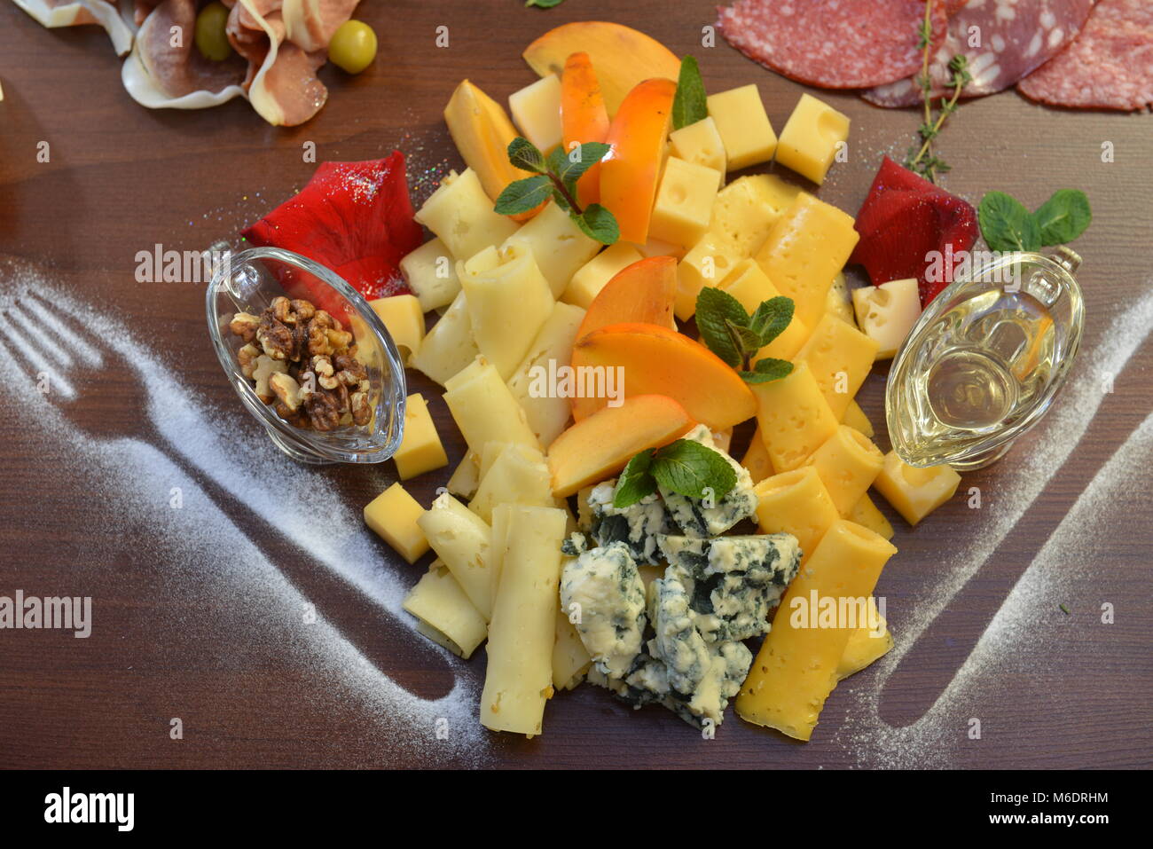 Assorted sliced cheese with mildew, blue, brie, swiss , cheddar ...