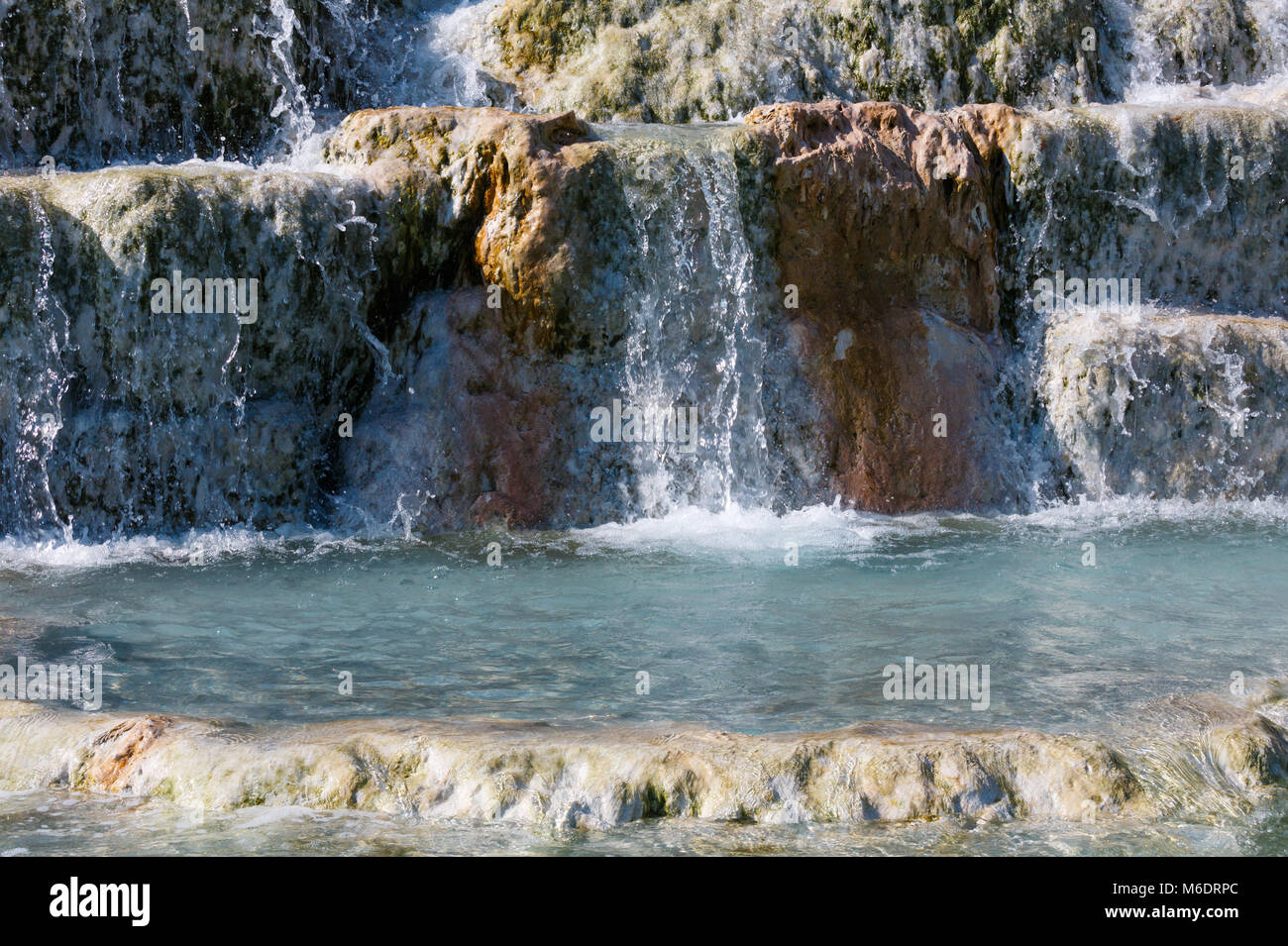 Natural spa with waterfalls and hot springs at Saturnia thermal baths ...