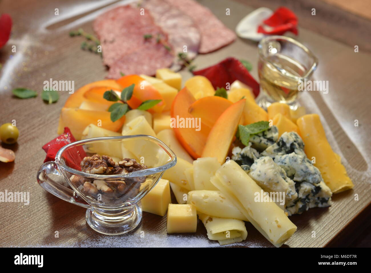 Assorted sliced cheese with mildew, blue, brie, swiss , cheddar ...