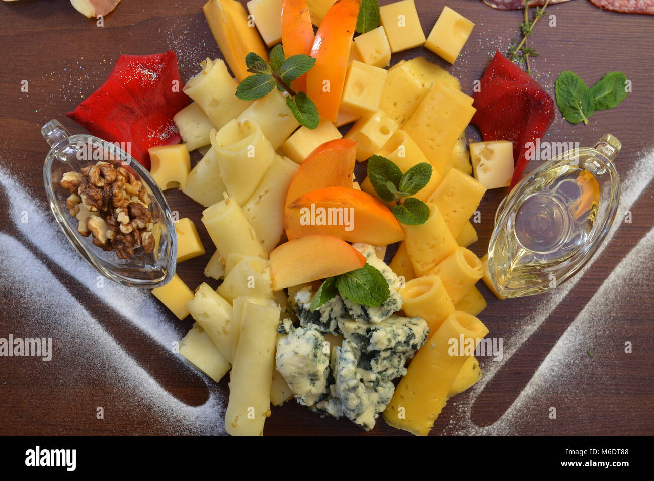 Assorted sliced cheese with mildew, blue, brie, swiss , cheddar ...