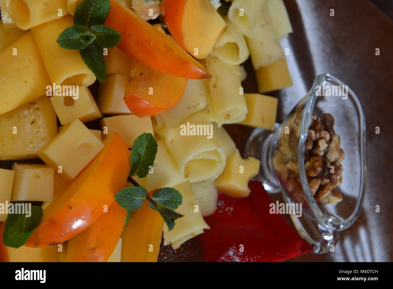 Assorted sliced cheese with mildew, blue, brie, swiss , cheddar ...