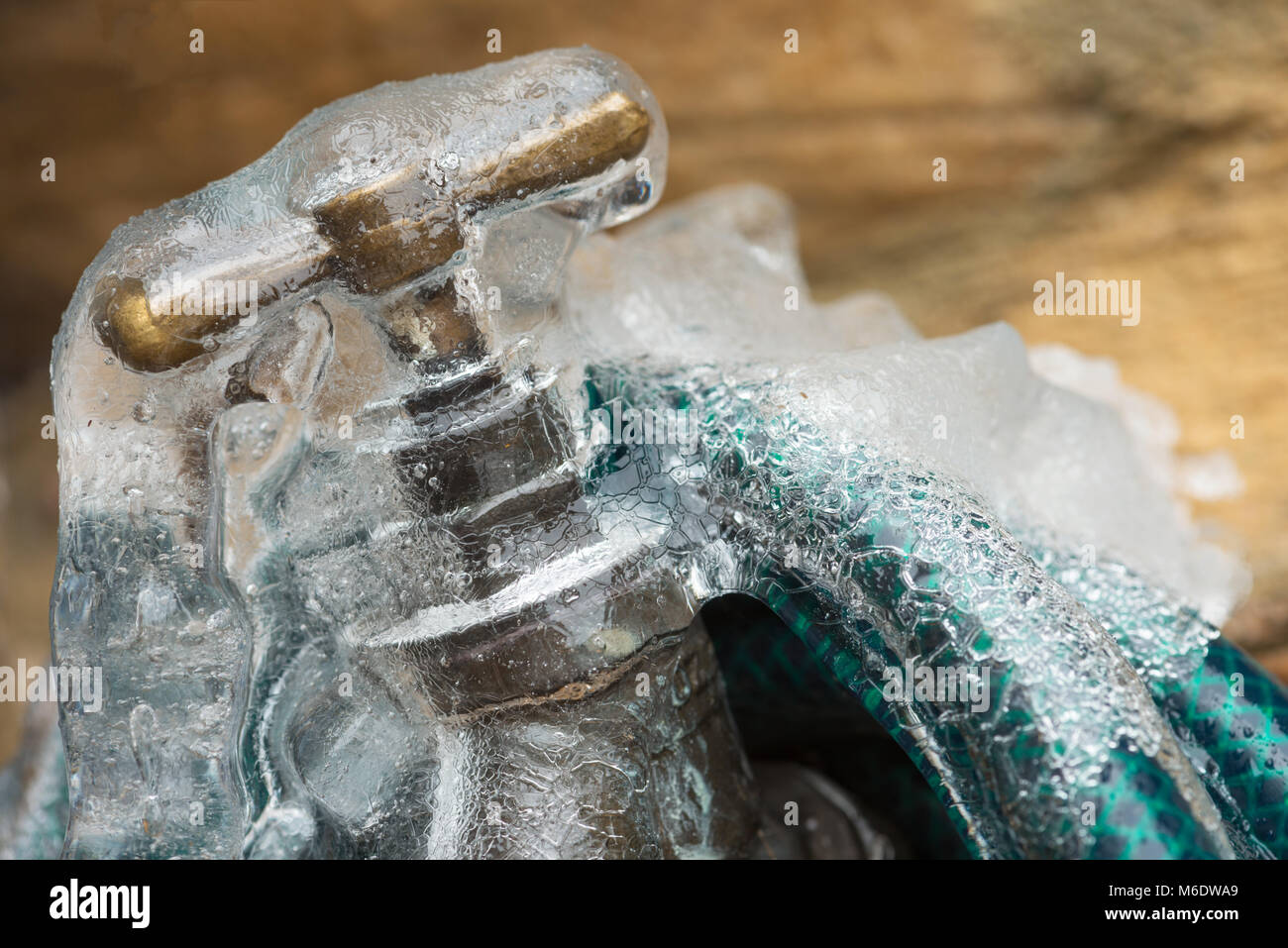 Frozen garden tap covered in ice Stock Photo - Alamy