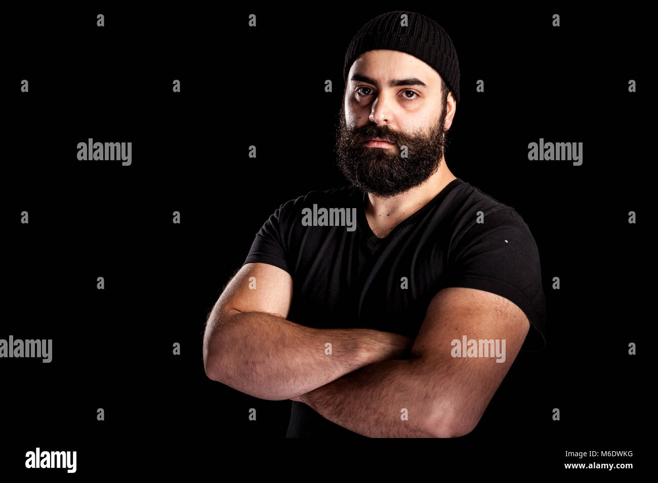 Angry bearded hipster guy on black background Stock Photo - Alamy