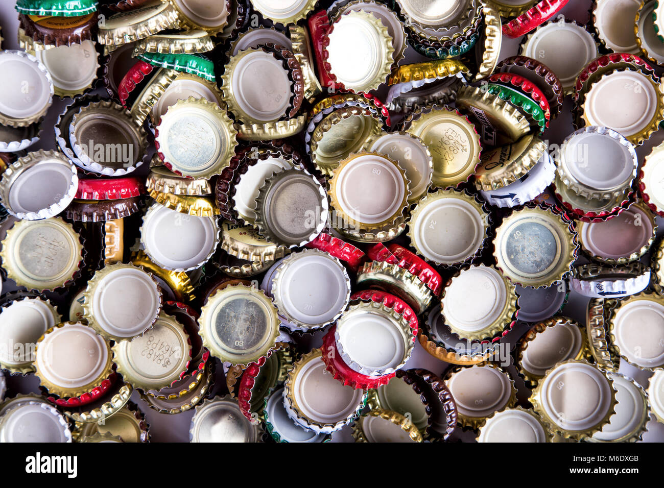 a lot of caps of beer, randomly scattered, background, top view Stock ...