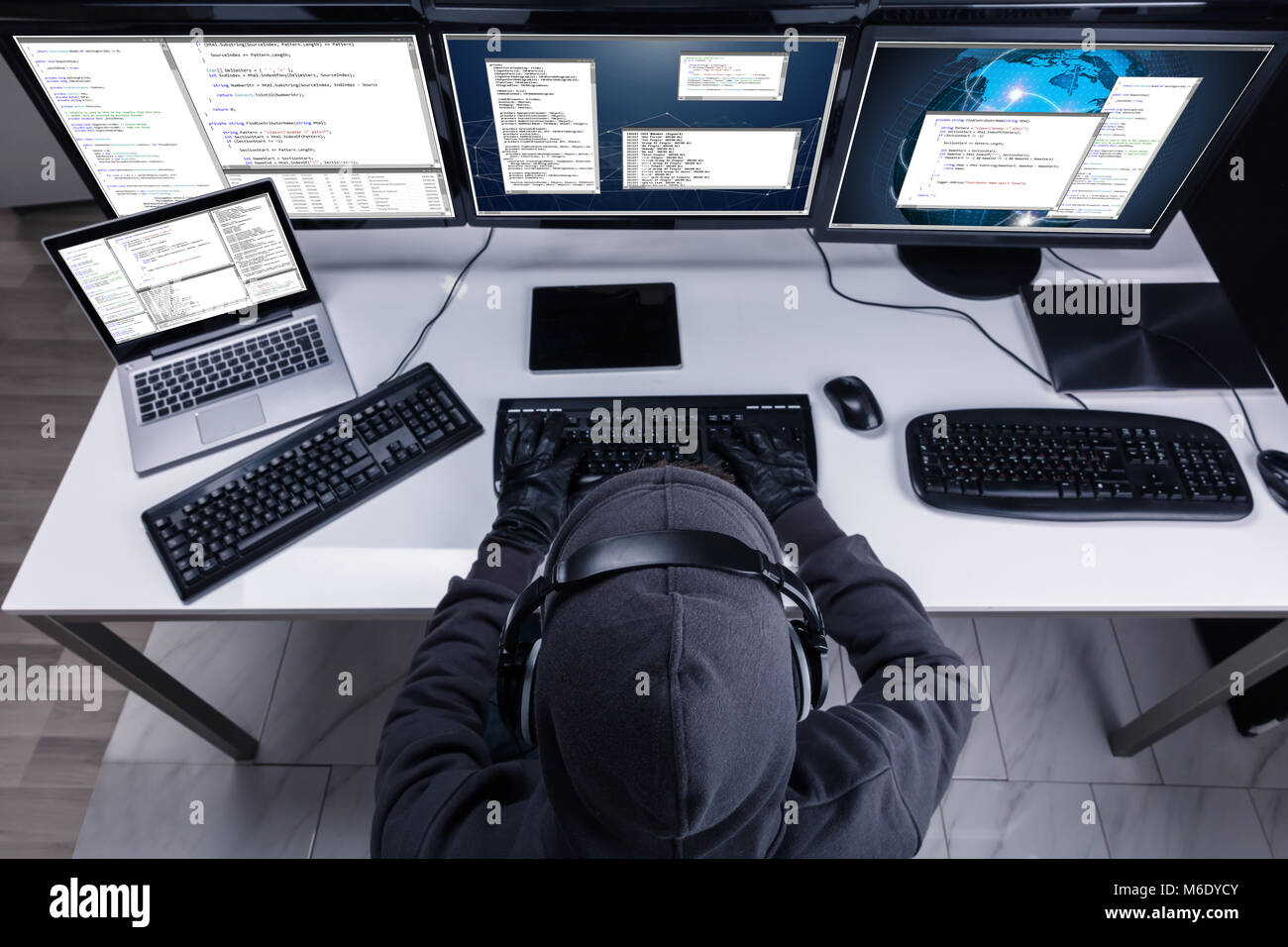 Man hacker in hood headphones hi-res stock photography and images - Alamy