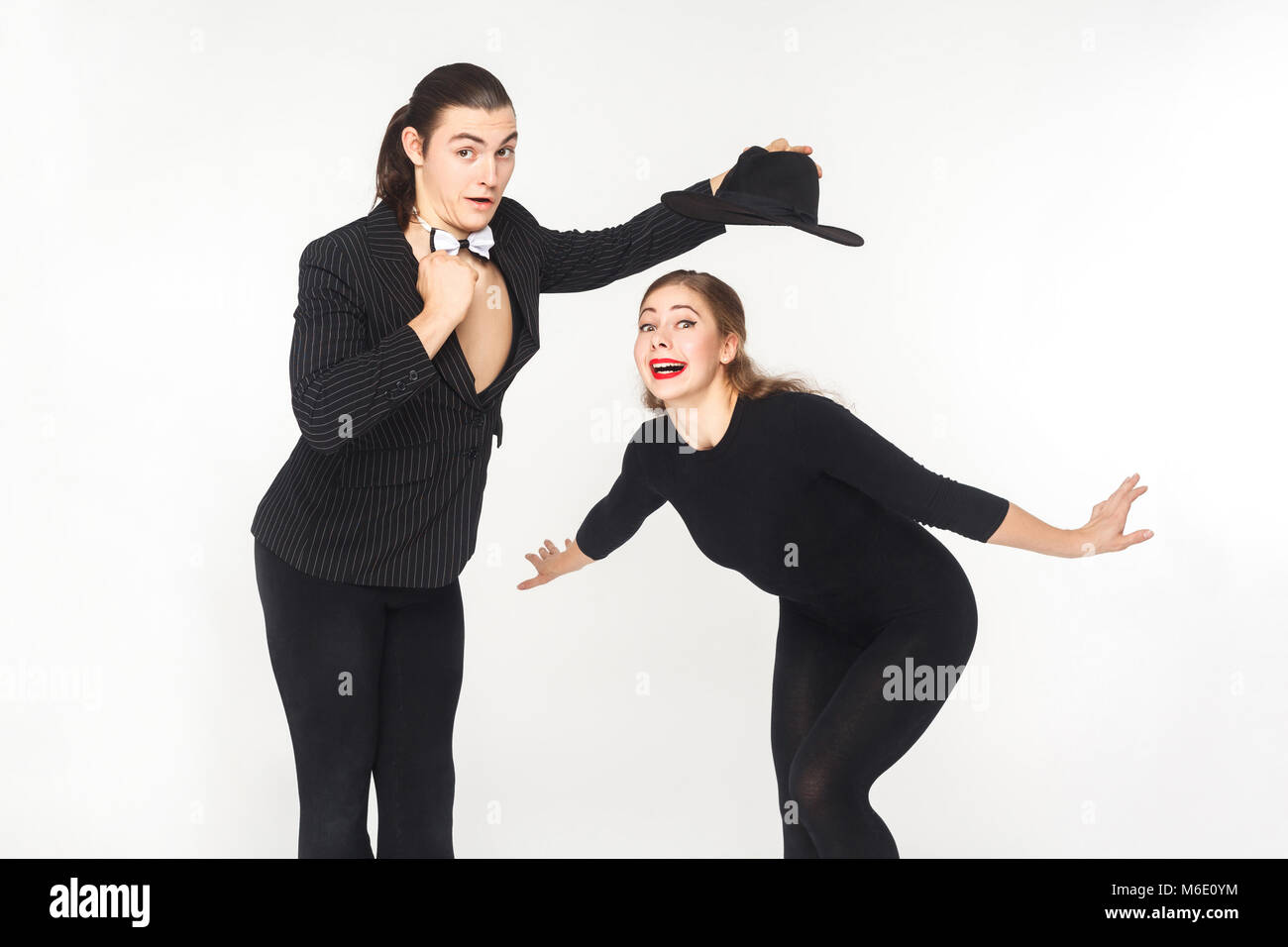 Two comedian circus artist posing and looking at camera. Studio shot ...