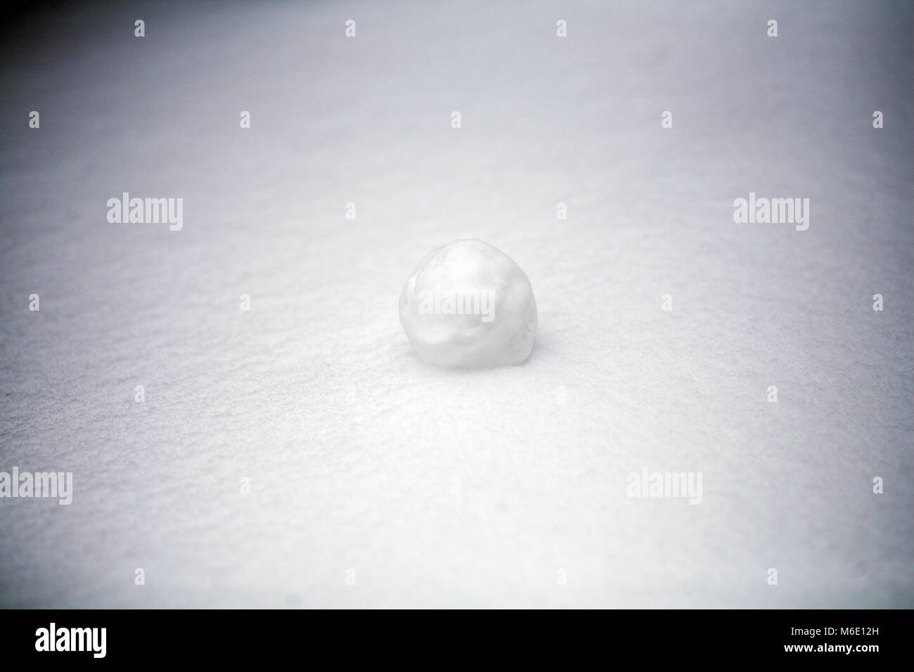 real snowballs with their hands clasped from the fresh snow in winter ...