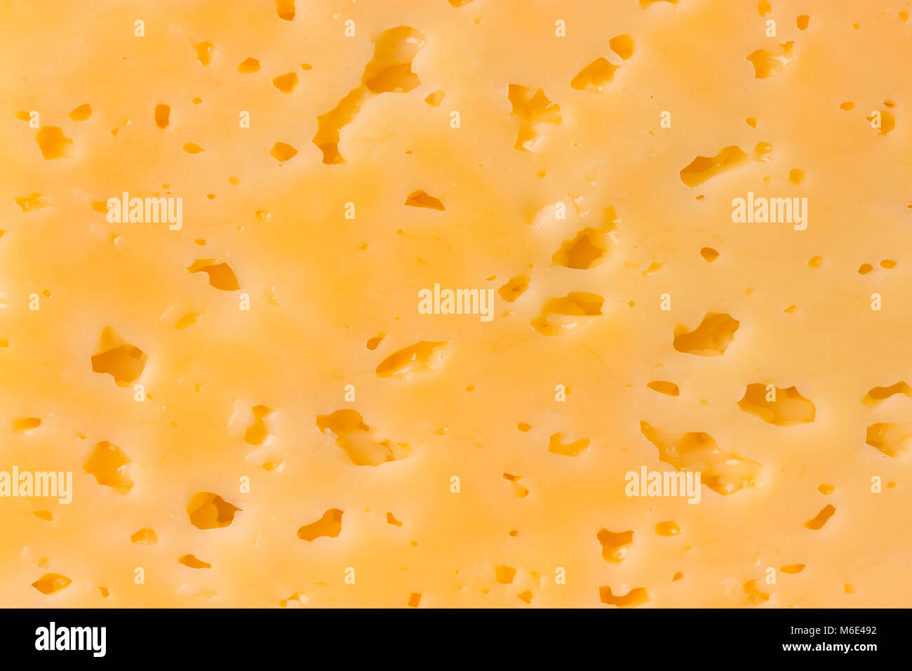 Cheese surface with openings close up texture Stock Photo - Alamy