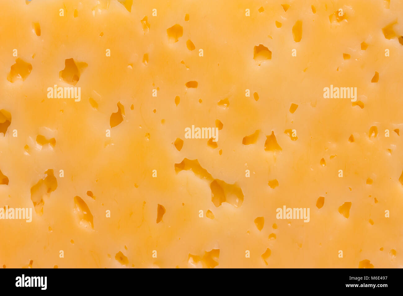 Cheese surface with openings close up texture Stock Photo - Alamy