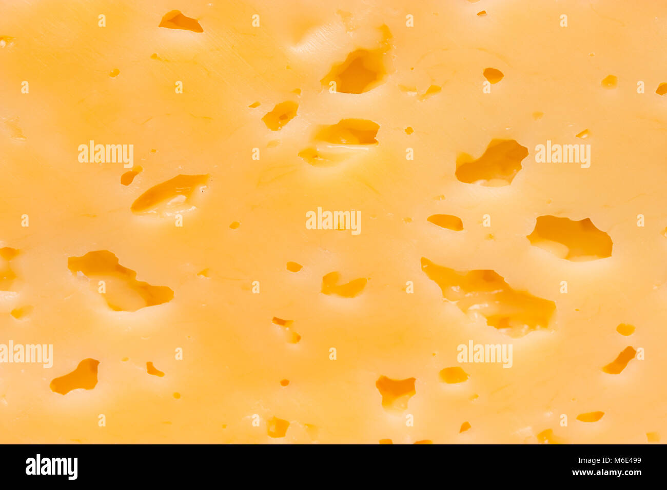 Cheese surface with openings close up texture Stock Photo - Alamy