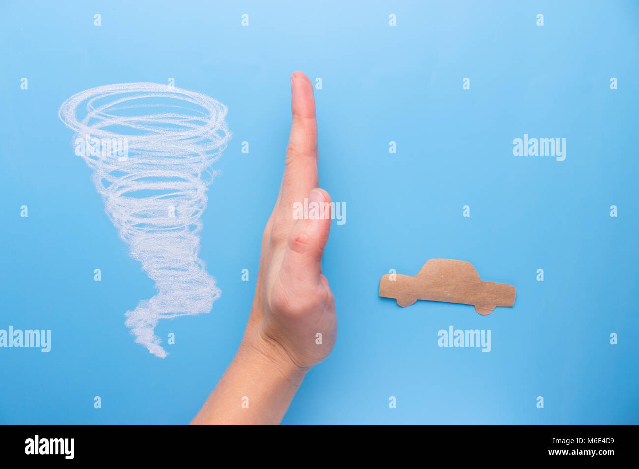 Protection of car. hand protect car from tornado Stock Photo - Alamy
